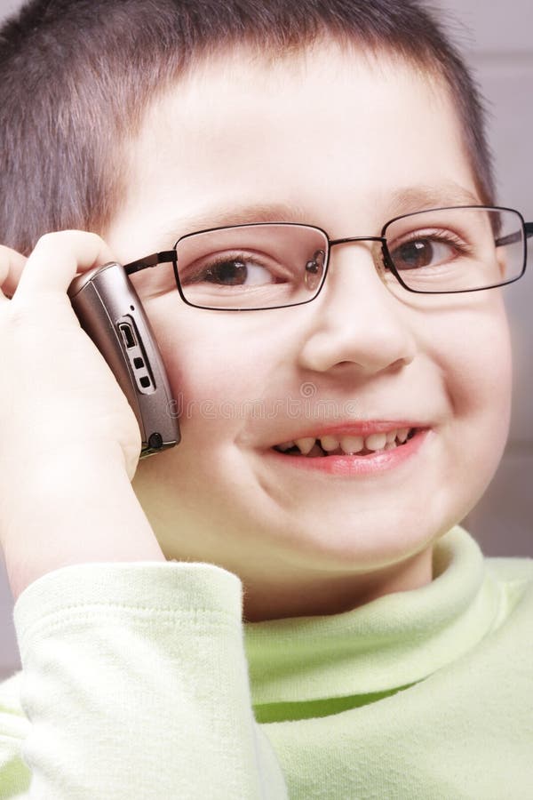 Smiling Boy with Cell Phone Stock Image - Image of eyes, vertical: 12560033