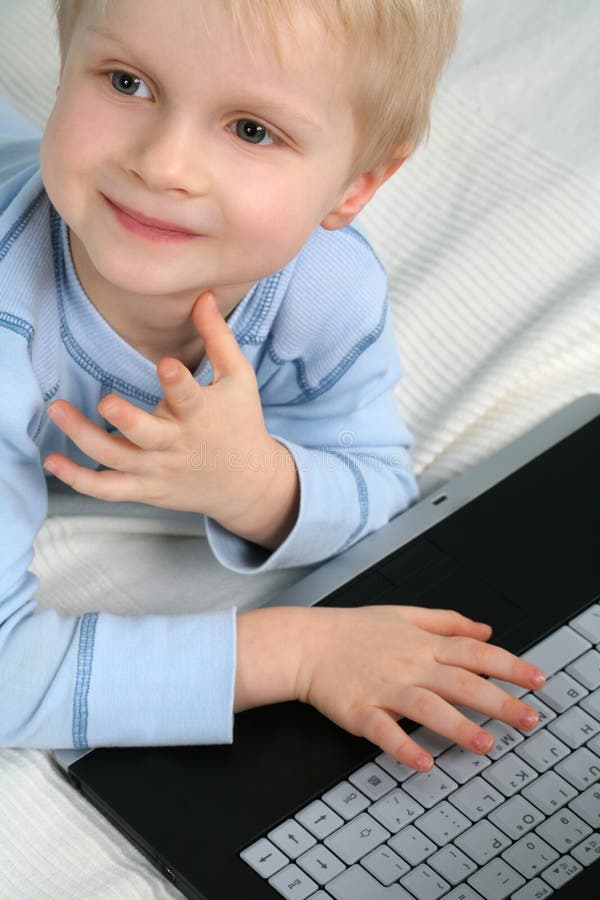 Smiling Boy and Computer stock photo. Image of process - 1981358