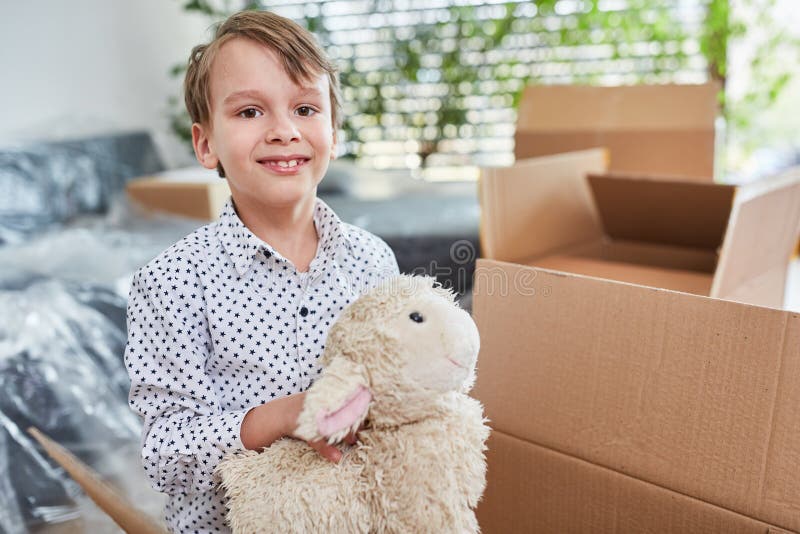 Smiling Boy with Cuddly Toy while Moving Stock Image - Image of pack ...