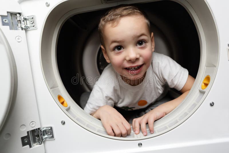 Smiling boy in the dryer stock image. Image of equipment - 64000051