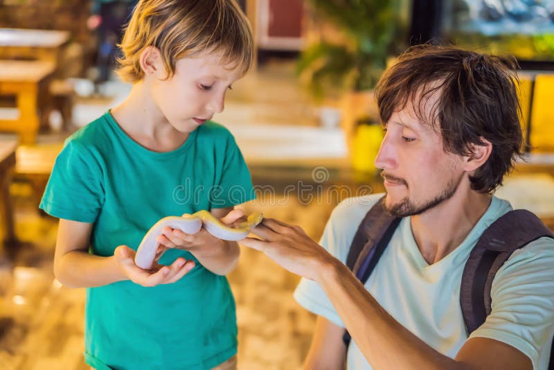 169 Kid Holding Snake Stock Photos - Free & Royalty-Free Stock Photos ...