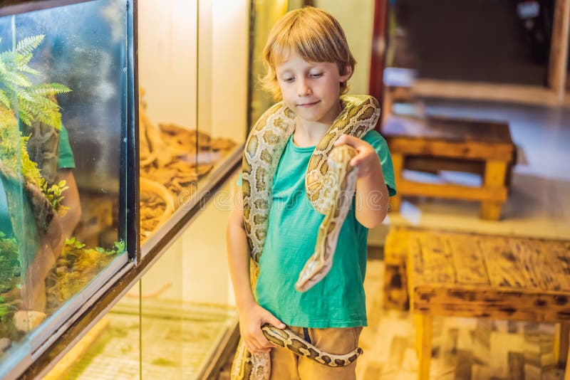 169 Kid Holding Snake Stock Photos - Free & Royalty-Free Stock Photos ...