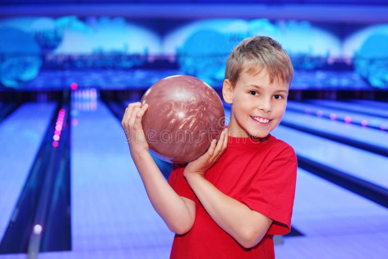 Smiling Boy Holds Ball in Bowling Club Stock Image - Image of people ...