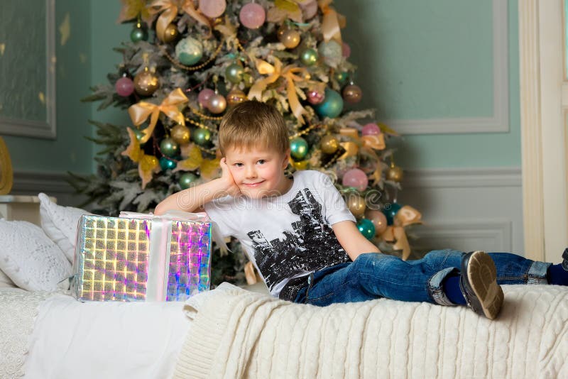 Smiling Boy Hugging the Box Close . New Year Stock Photo - Image of ...