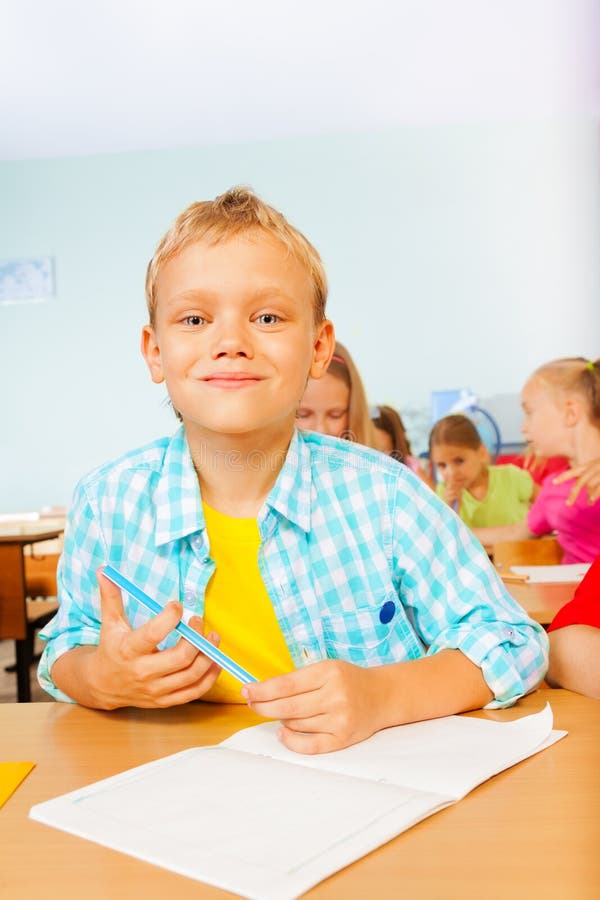 Smiling Boy Looks while Writing in Exercise Book Stock Image - Image of ...
