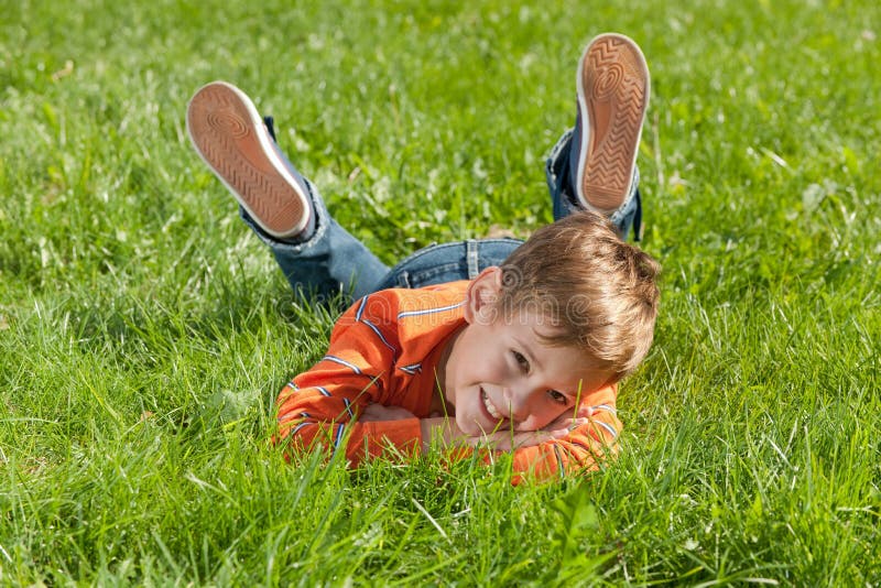 Handsome Boy on the Green Grass Stock Image - Image of caucasian, dream ...