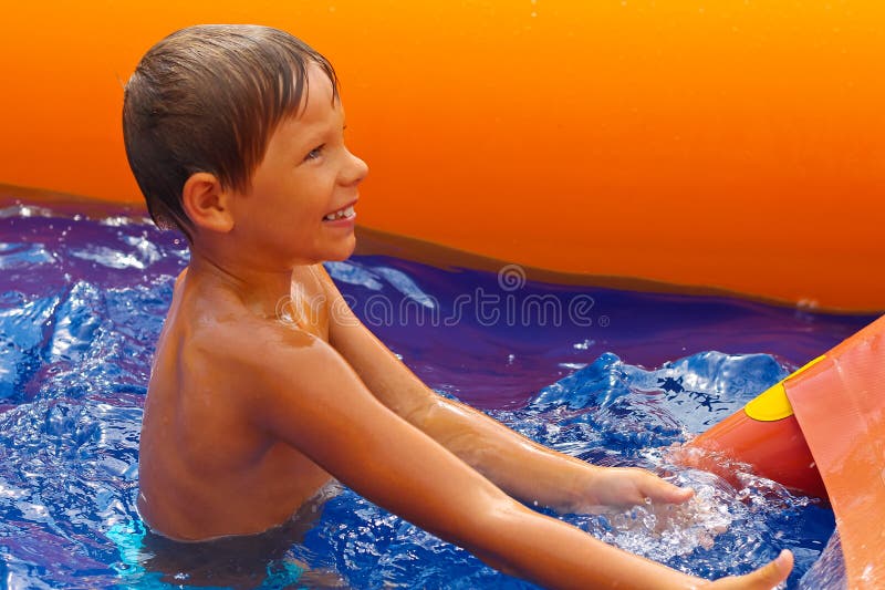 Smiling Boy Near Waterslide. Stock Image - Image of park, outdoors ...