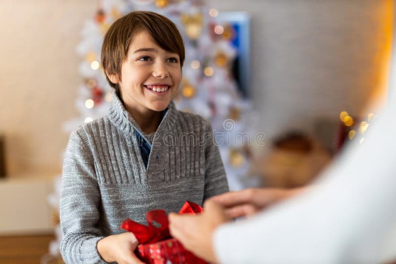 Smiling Boy Receiving Gift at Christmas Stock Image - Image of ...