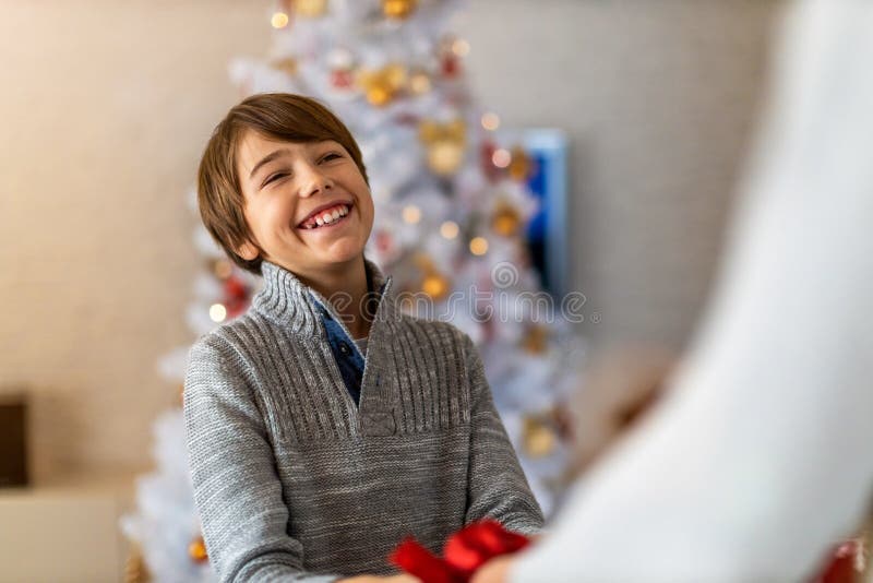 Smiling Boy Receiving Gift at Christmas Stock Image - Image of enjoying ...
