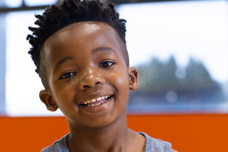 Smiling Boy in School Classroom, Looking at Camera with Cheerful ...