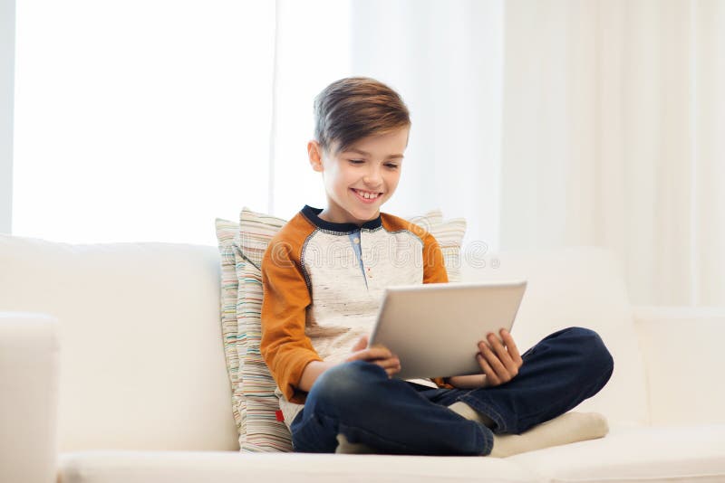 Smiling Boy with Tablet Computer at Home Stock Image - Image of reading ...