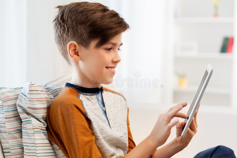 Smiling Boy with Tablet Pc Computer at Home Stock Photo - Image of ...
