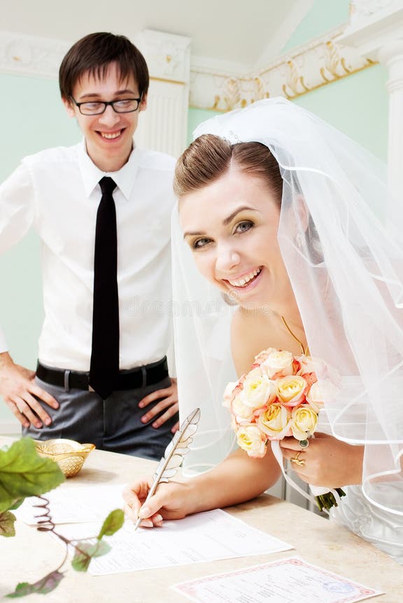 Smiling Bride Signing Marriage Papers Stock Image - Image of posy ...