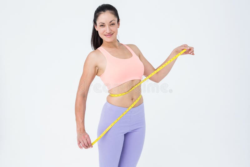 Smiling Brunette Holding Measuring Tape and Looking at Camera Stock ...