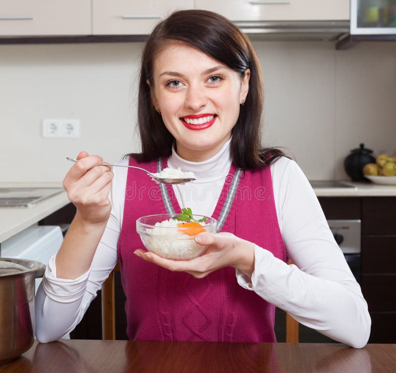 Smiling Brunette Woman Eating Boiled Rice Stock Photo - Image of dish ...