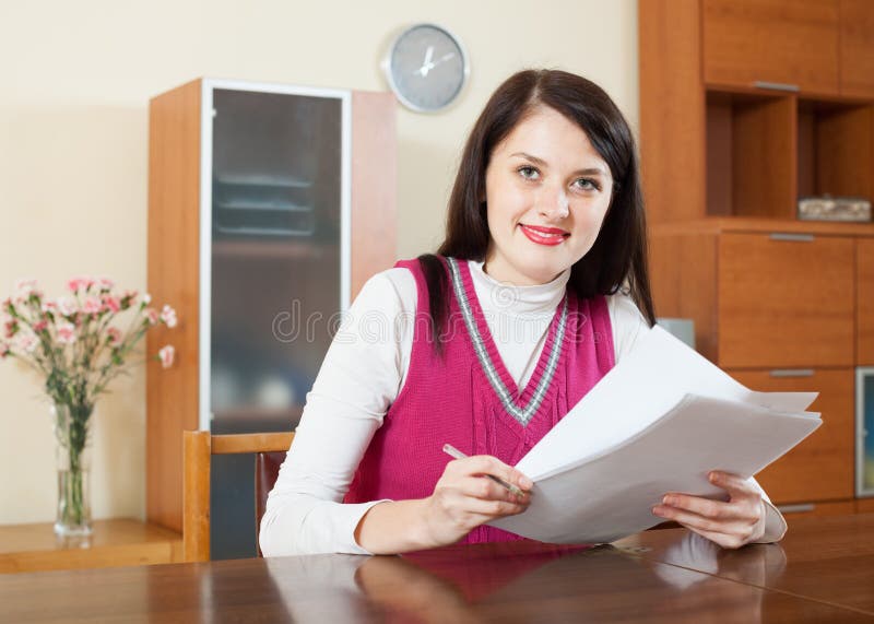 Smiling Brunette Woman Reading Document Stock Photo - Image of house ...
