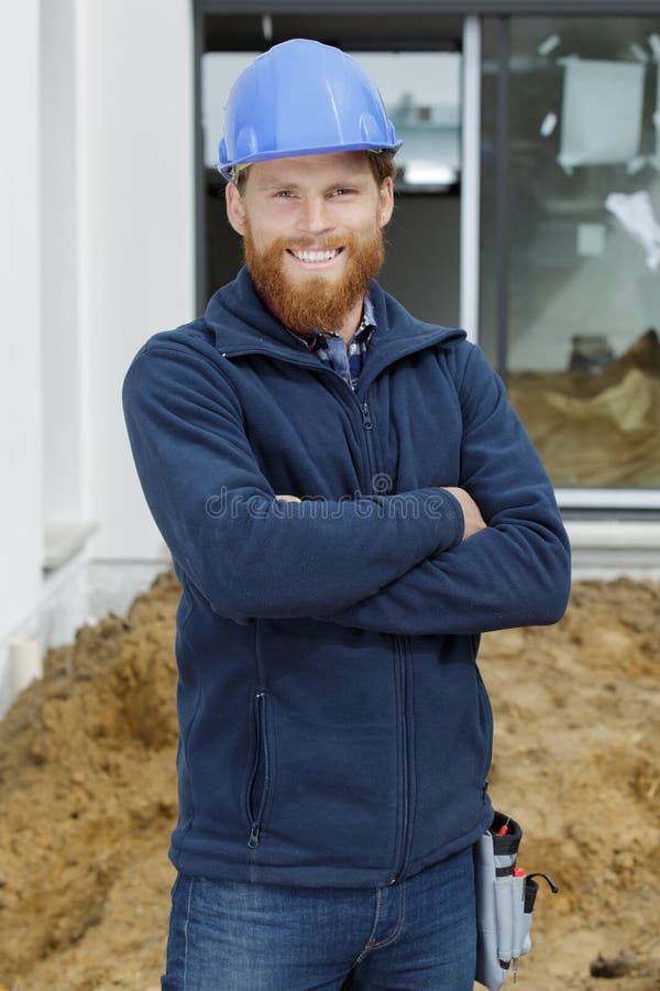 Smiling Builder in Construction Site Stock Photo - Image of glasses ...