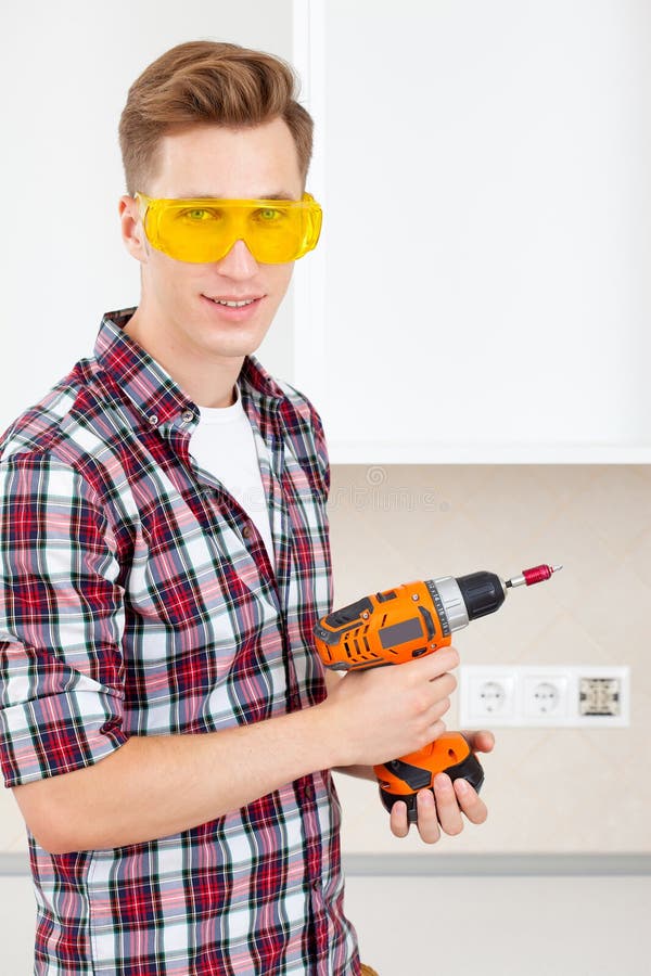 Smiling Builder with a Dril Stock Image - Image of middle, construction ...