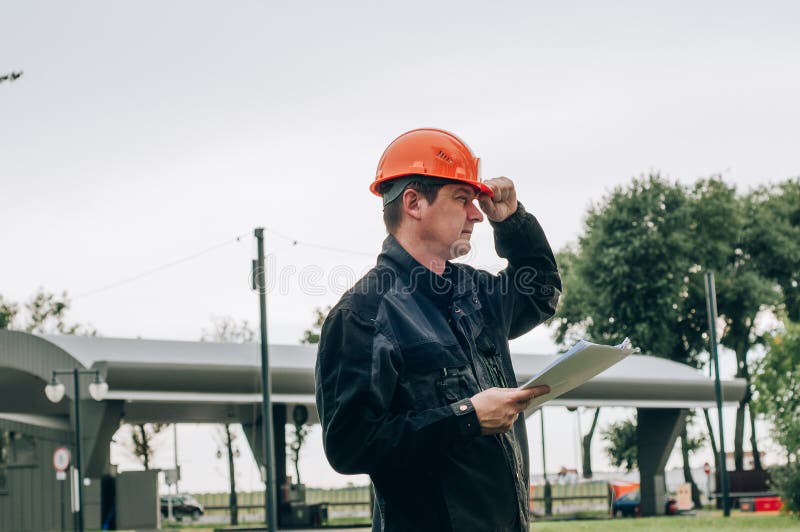 The Road Inspector on a Working Platform. Stacking of New Asphalt Stock ...