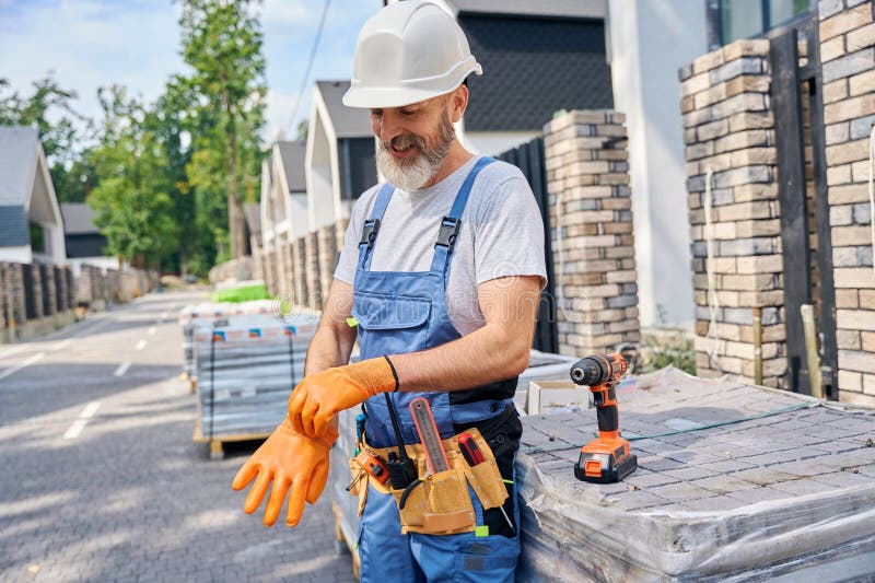 Smiling Builder Preparing for Masonry Work on Construction Site Stock ...