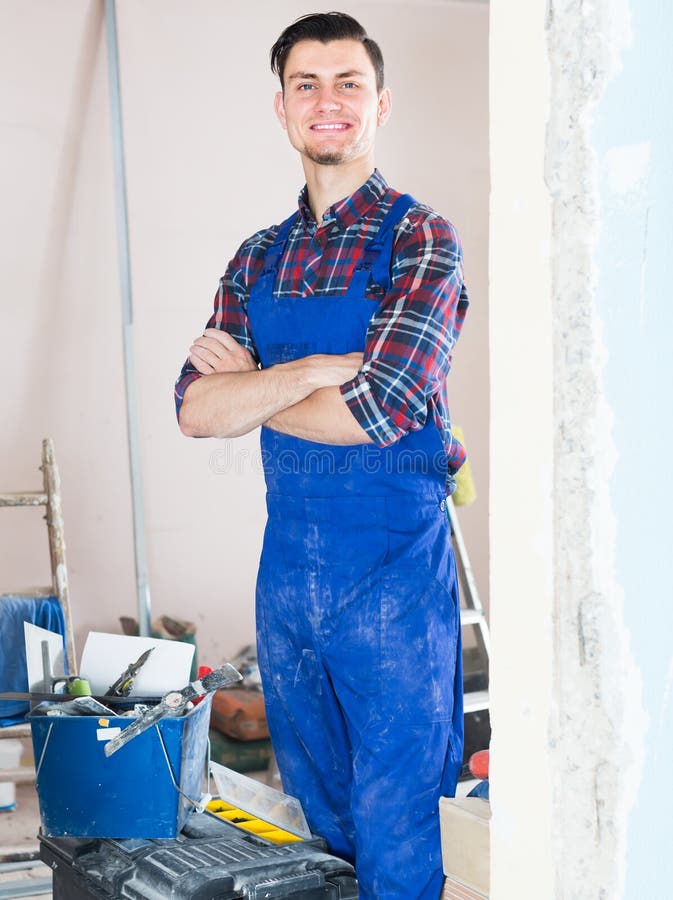 Smiling Builder Standing in Repairable Room Stock Image - Image of ...