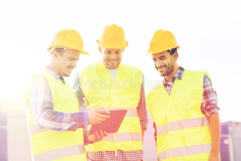 Smiling Builders in Hardhats with Tablet Pc Stock Image - Image of ...