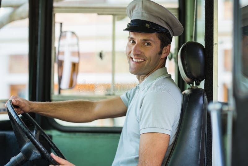 Bus driver driving a bus stock photo. Image of transportation - 73219764