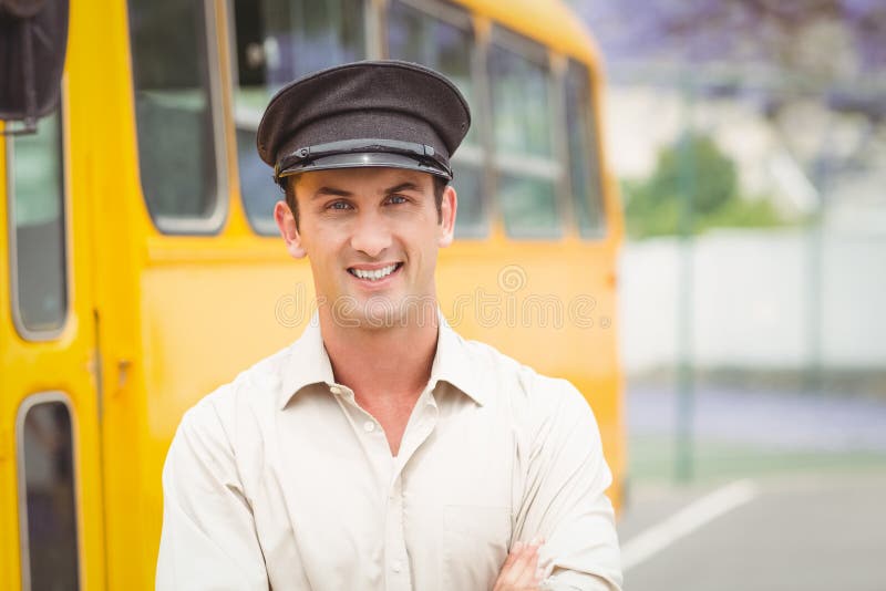 Smiling Bus Driver Leaning With Hands In Pocket In Front Of Bus Stock ...