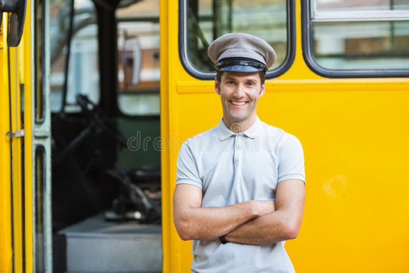 Smiling Bus Driver Standing with Arms Crossed in Front of Bus Stock ...