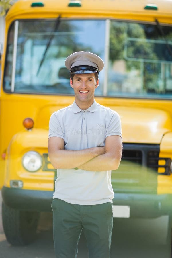 Smiling Bus Driver Standing with Hands in Pocket in Front of Bus Stock ...