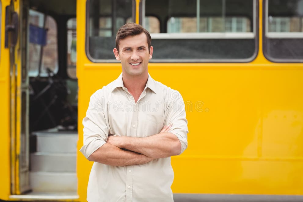 Smiling Bus Driver Standing with Arms Crossed Stock Image - Image of ...