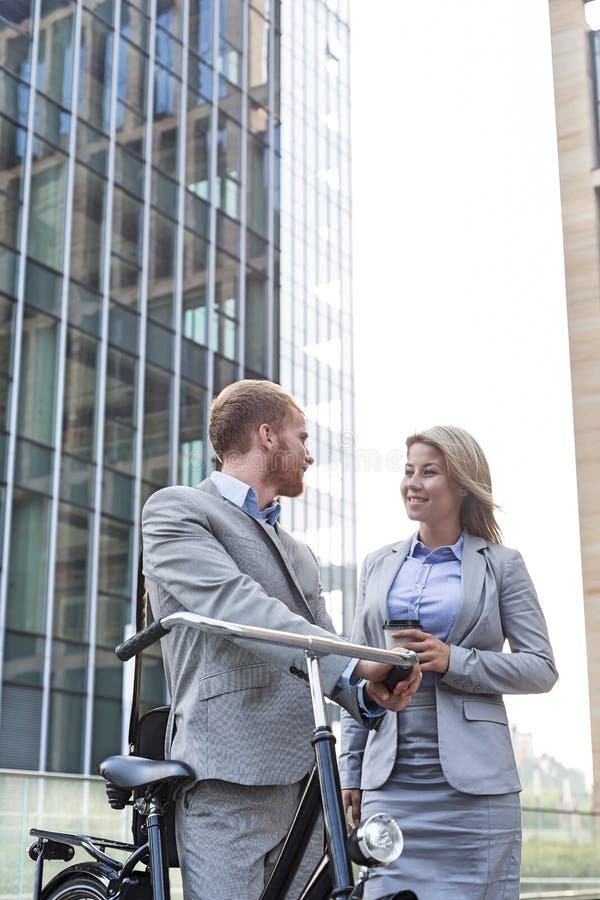 Smiling Business Couple Talking Outside Office Building Stock Photo ...