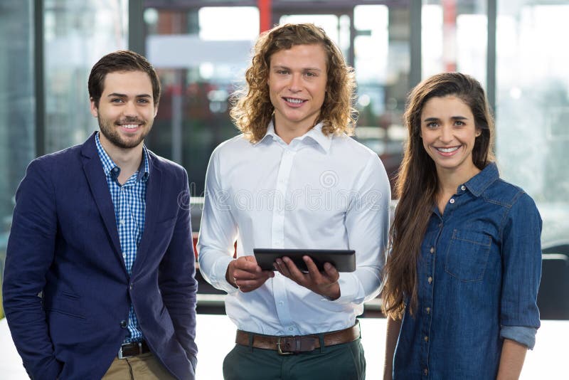 Smiling Business Executives Standing in Office Stock Image - Image of ...