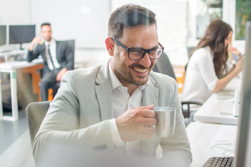 Smiling Business Man Drinking Coffee during Office Break Stock Photo ...