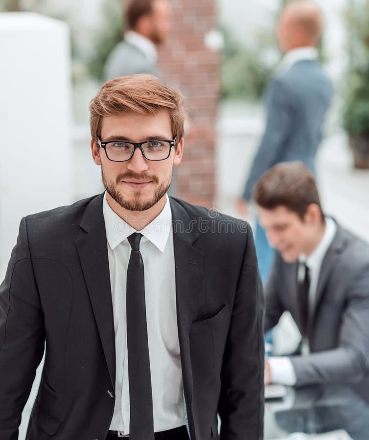 Smiling Business Man Standing in the Office Stock Photo - Image of ...