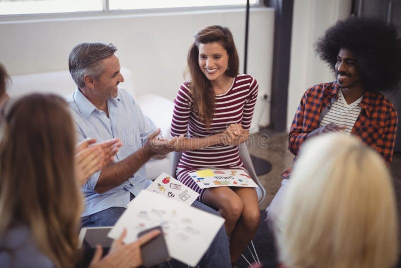 Smiling Business People Having Discussion in Creative Office Stock ...