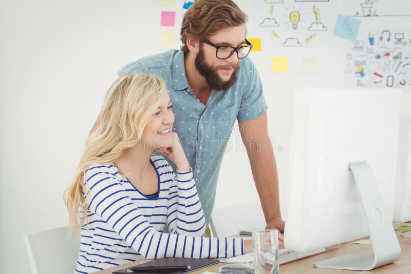 Smiling Business People Looking at Computer Stock Photo - Image of ...