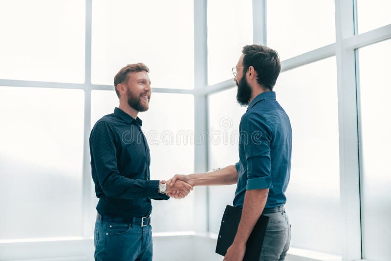 Smiling Business People Shaking Hands in the Office. Stock Photo ...