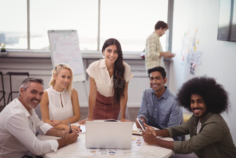 Smiling Business People Sitting in Creative Office Stock Image - Image ...
