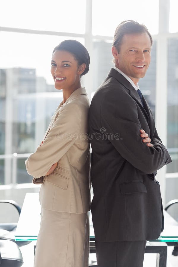 Smiling Business People Standing Back To Back Stock Photo - Image of ...