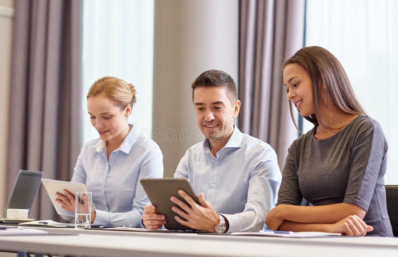 Smiling Business People with Tablet Pc in Office Stock Image - Image of ...