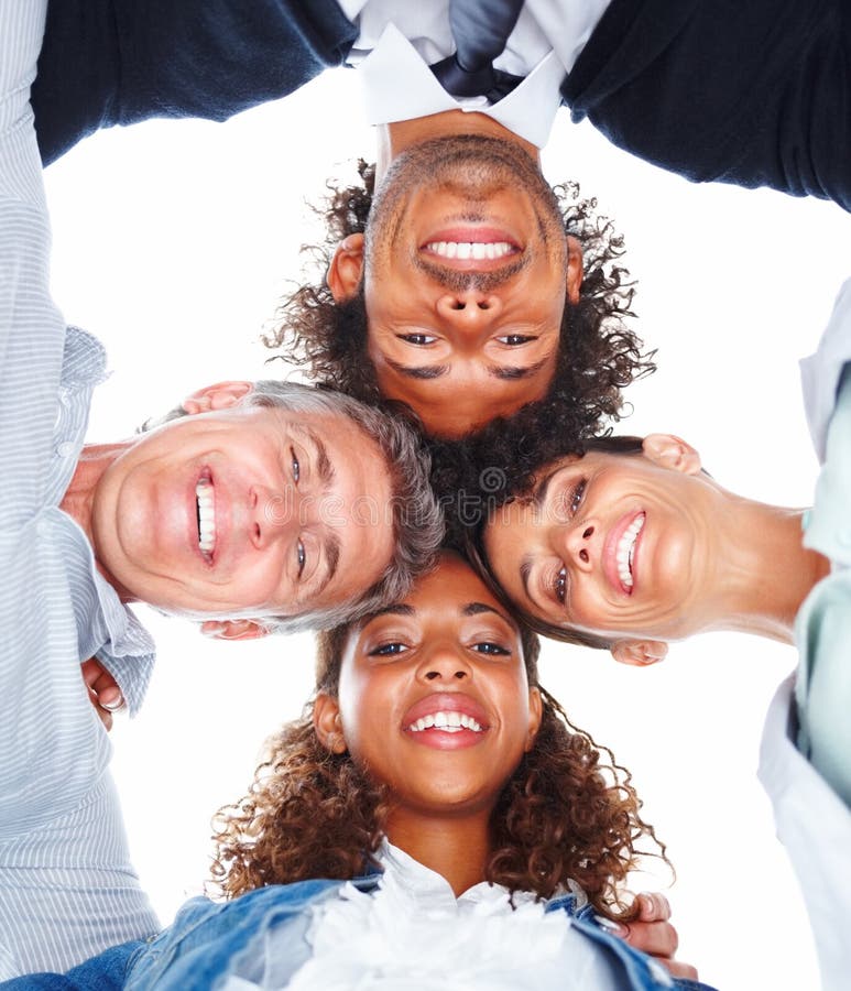 Smiling Business People with Their Heads Together Stock Image - Image ...