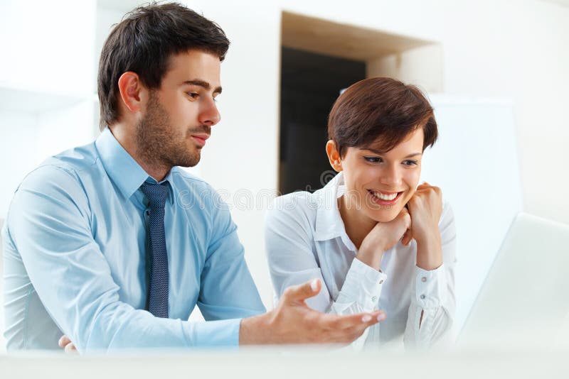 Smiling Business People Working Together in the Office Stock Photo ...