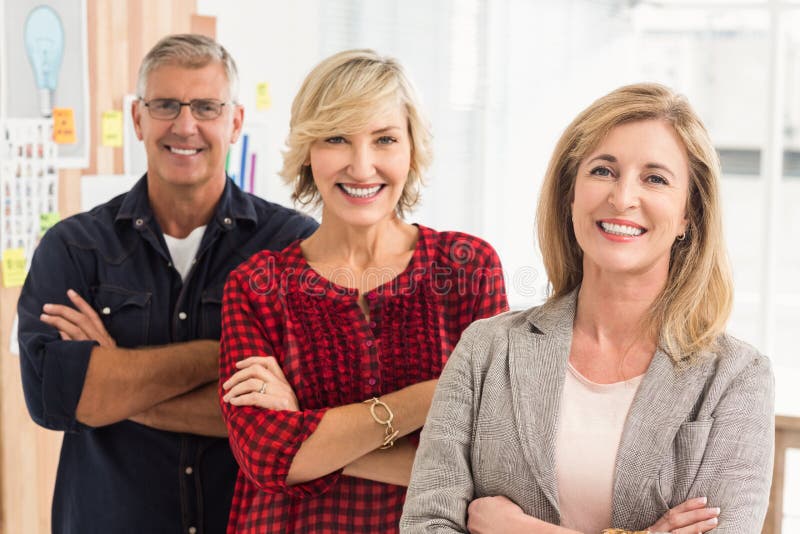 Smiling Business Team Looking at the Camera Stock Photo - Image of ...