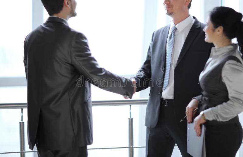 Smiling Business Team Looking at a Financial Chart Stock Image - Image ...