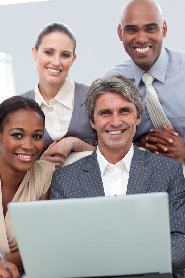 Smiling Business Team Working at a Laptop Stock Photo - Image of ...