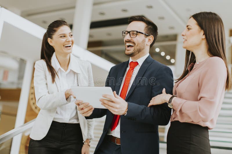 Smiling Business Team Working with Tablet Pcs in Office Stock Photo ...