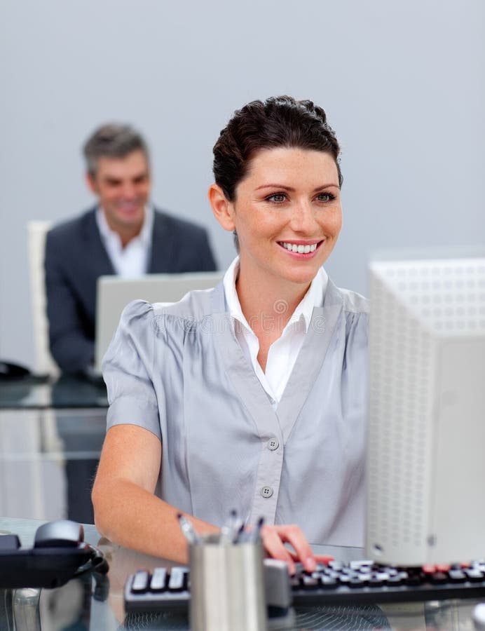 Smiling Business Woman Working at a Computer Stock Photo - Image of ...