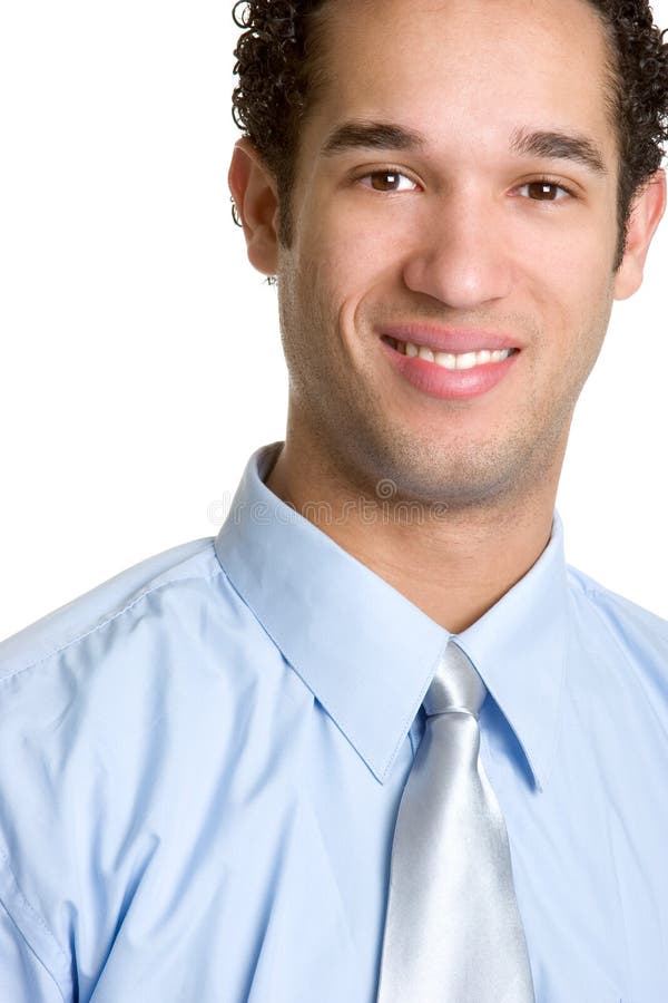 Smiling Businessman Working at Desk with Laptop and Documents in Modern ...