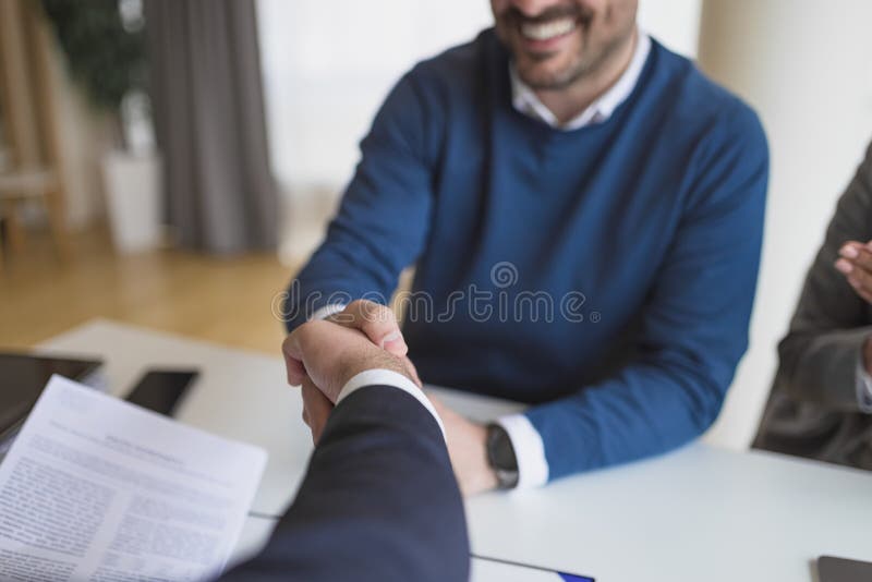 Smiling Businessman and Entrepreneur, Offering His Hand To His New ... Smiling Businessman and Entrepreneur, Offering His Hand To His New ...